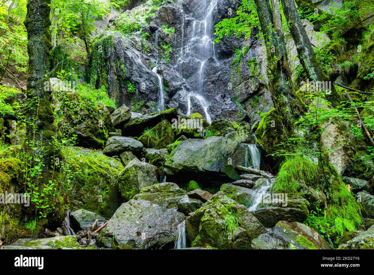 waterfall in deep mountain with large rocks Stock Photo - Alamy