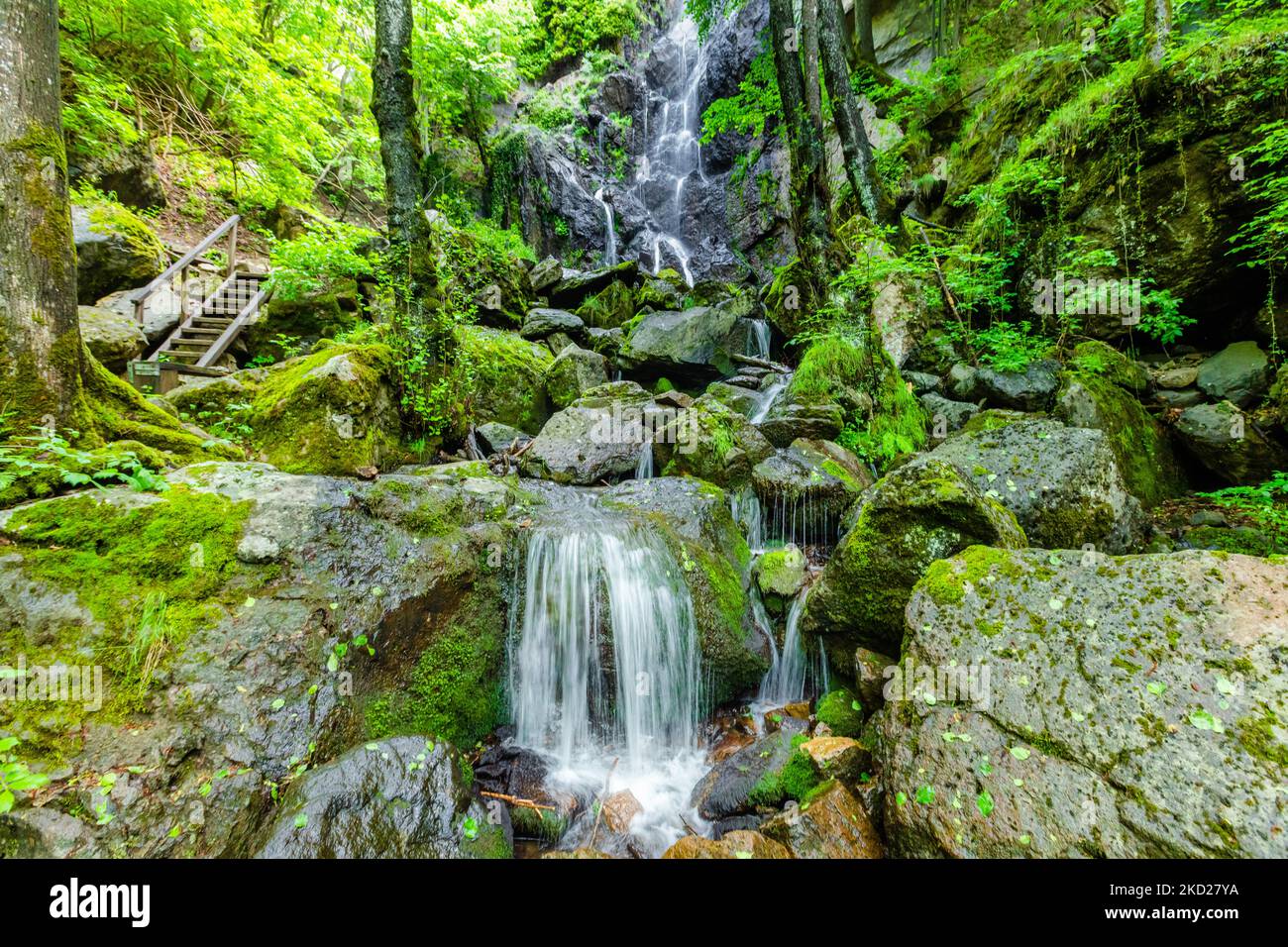 waterfall in deep mountain with large rocks Stock Photo - Alamy