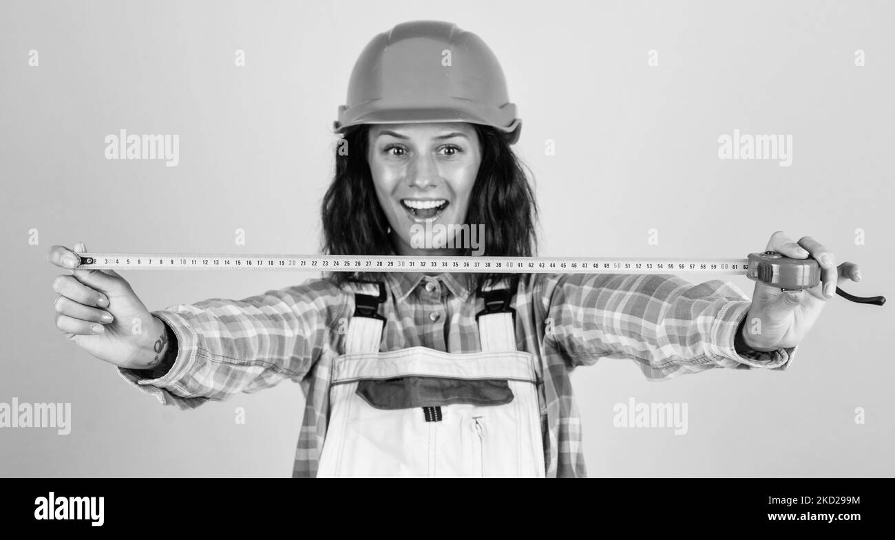 Living is in the details. woman wear protective helmet. girl builder in ...