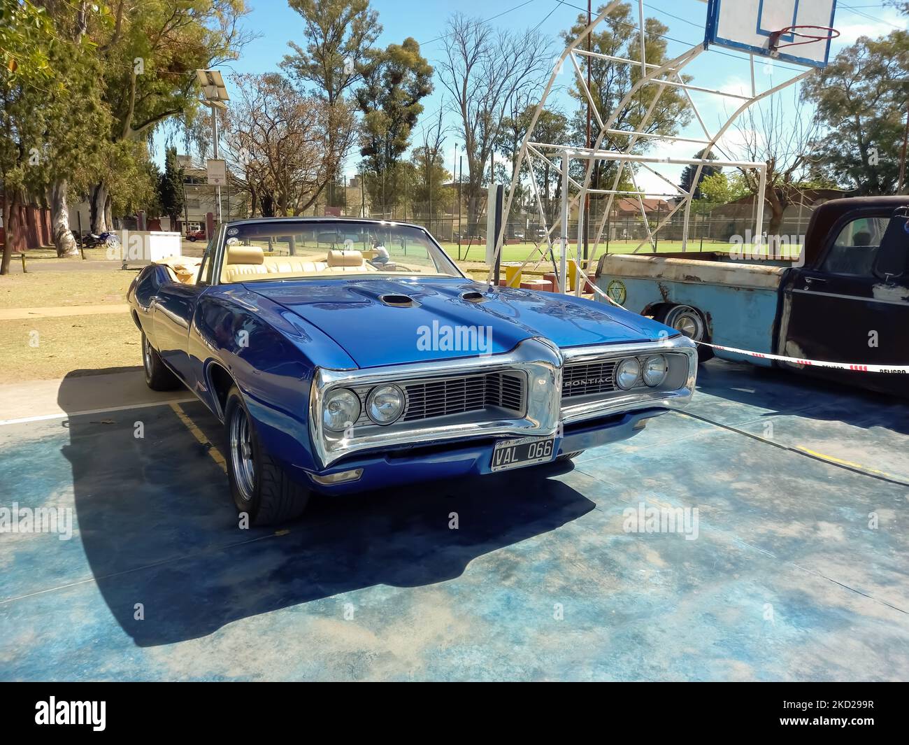 Old blue sport 1969 Pontiac GTO two door convertible in a park. Front ...