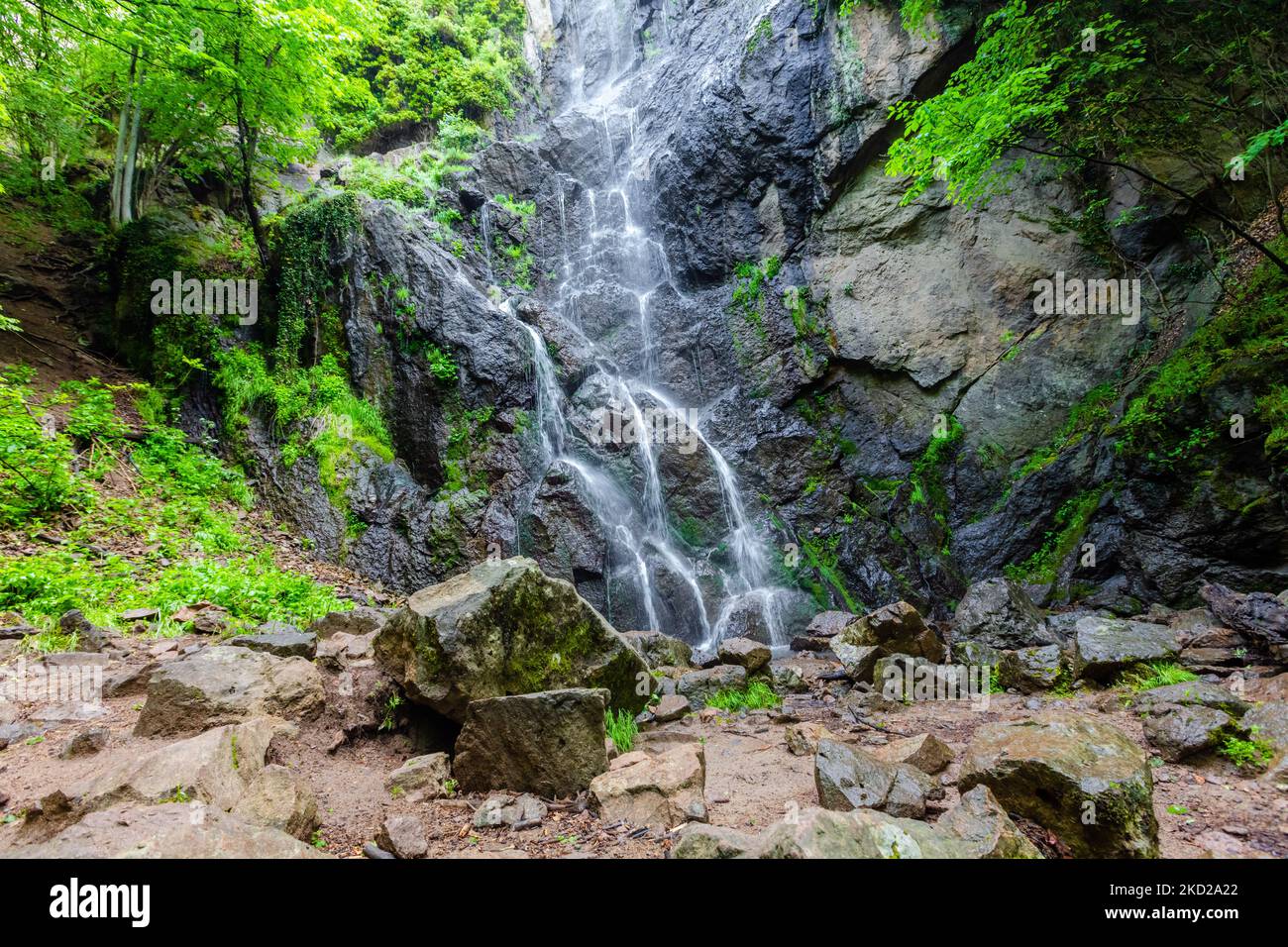 waterfall in deep mountain with large rocks Stock Photo - Alamy
