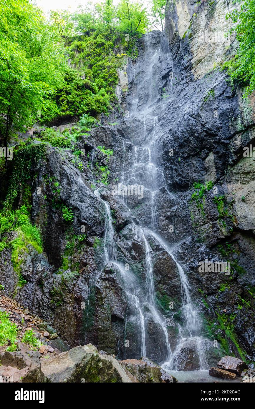 waterfall in deep mountain with large rocks Stock Photo - Alamy