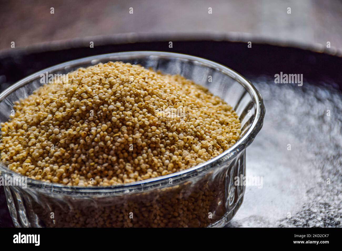 A selective shot of organic healthy dry raw barnyard millet in glass ...