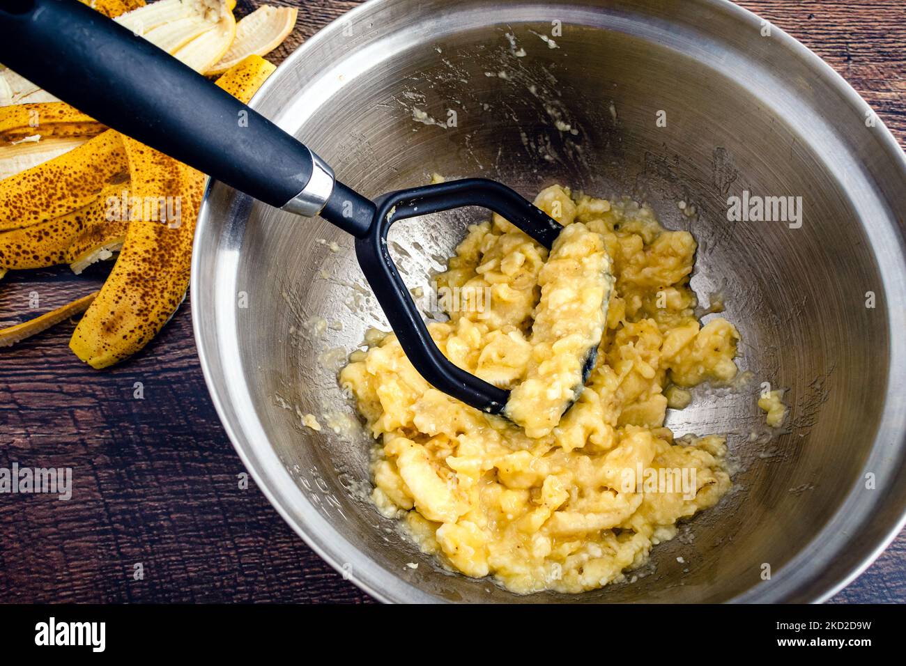 Mashed Banana in a Large Mixing Bowl: Mashed bananas and a potato ...