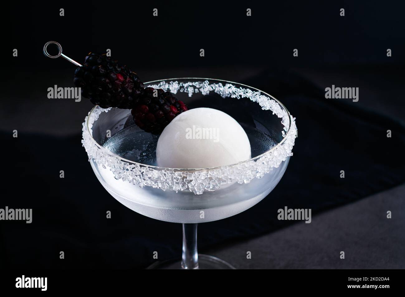 Full Moon Martini With Blackberry Garnish Closeup Vodka Cocktail With An Opaque White Ice