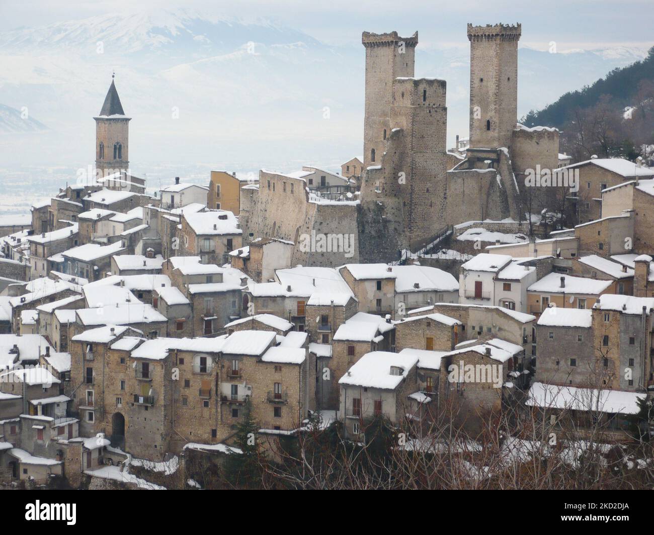 Snowy view of Pacentro and the Caldora or Cantelmo castle that ...