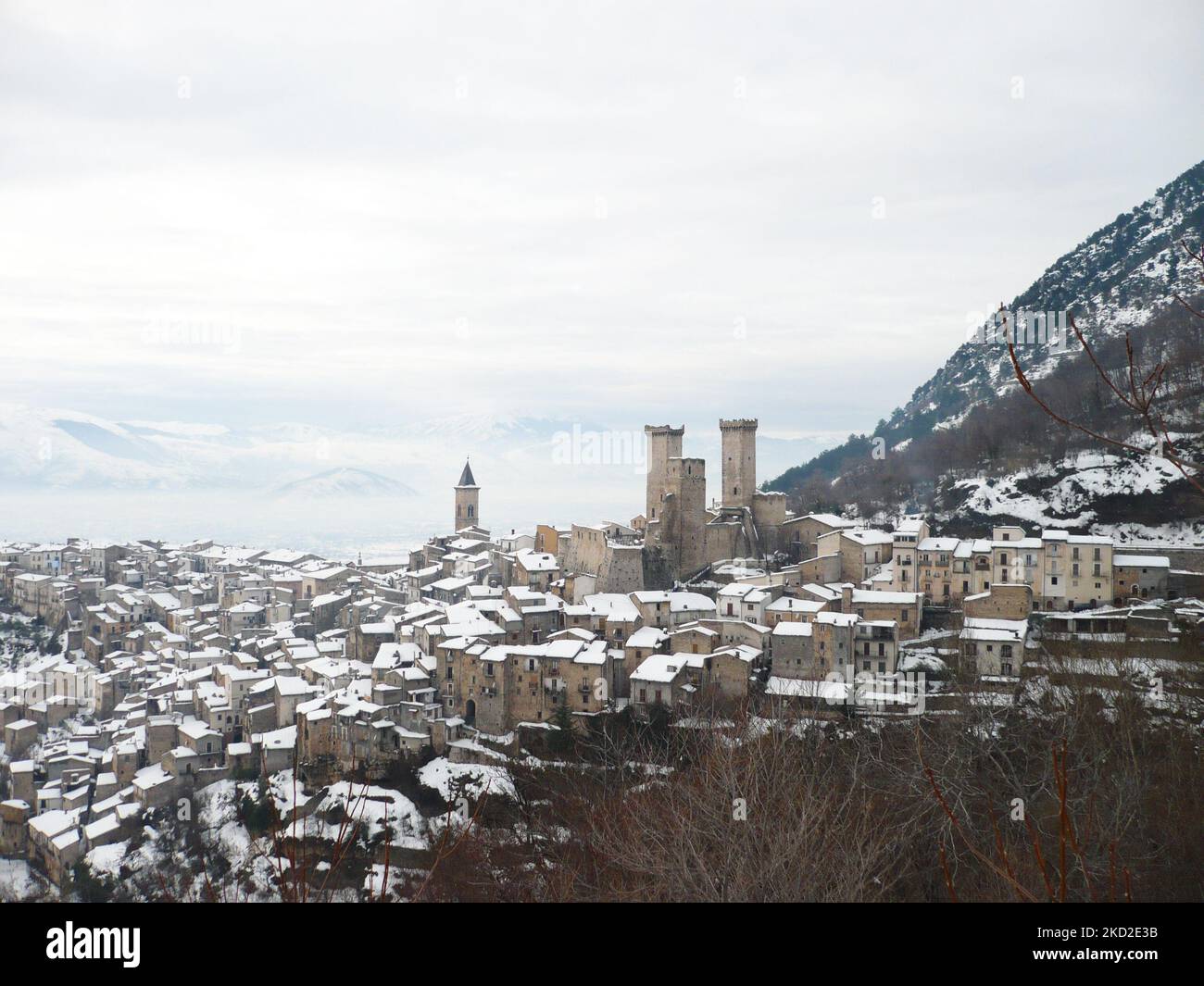 Snowy view of Pacentro and the Caldora or Cantelmo castle that ...