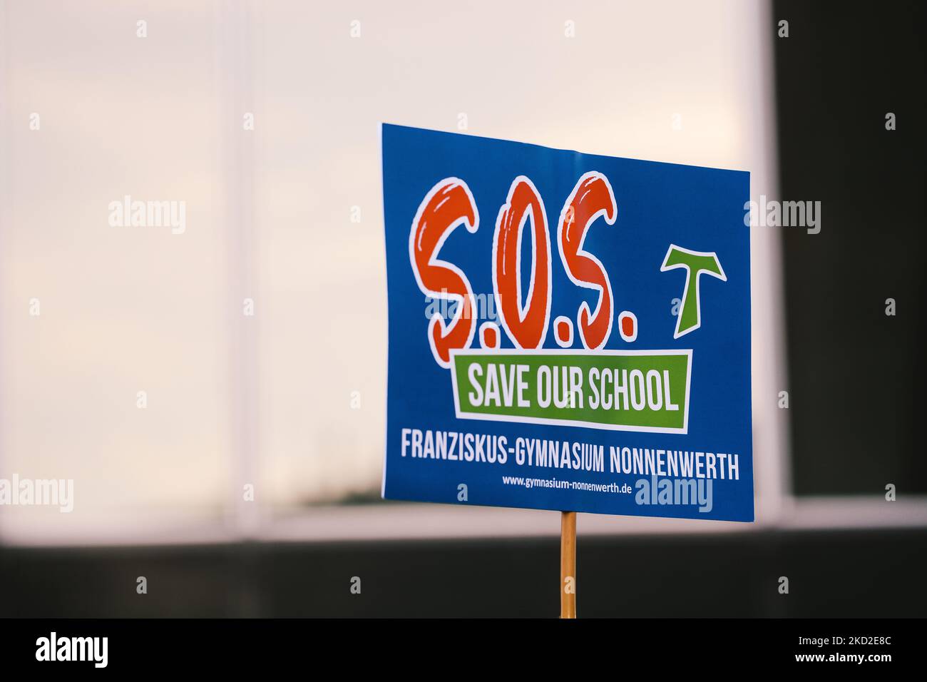 a sign " SOS save our school" is seen in front of Dom Cathedral for a ...