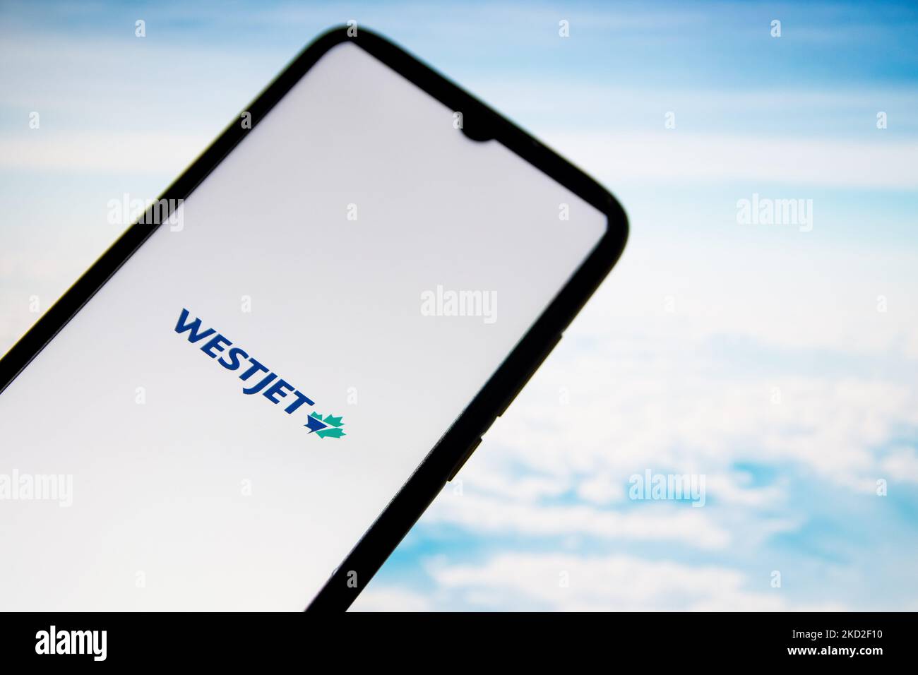 In this photo illustration a WestJet airlines logo seen displayed on a ...