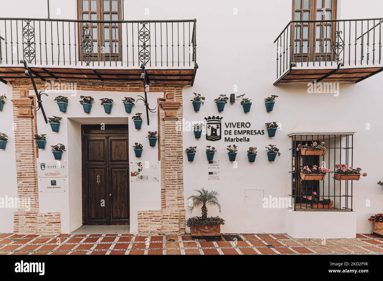 A beautiful shot of traditional house decorated with window flower ...
