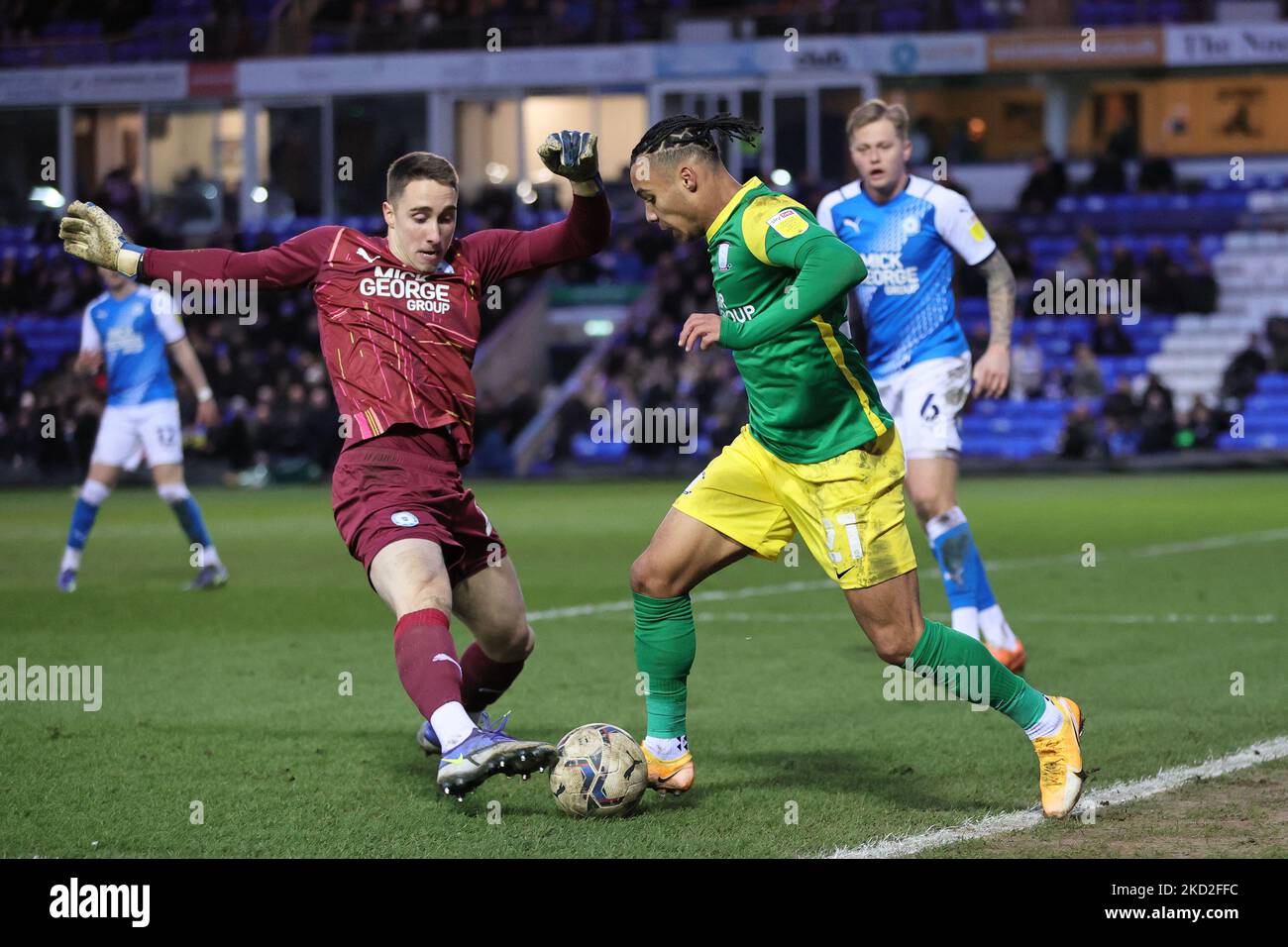 Peterborough Uniteds goalkeeper Steven Benda challenges Cameron Archer ...