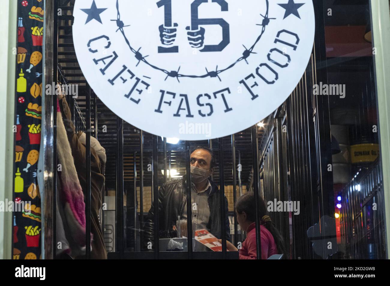 An Iranian man and his family at a cell in the CELL-16 fast food jail restaurant which has ...