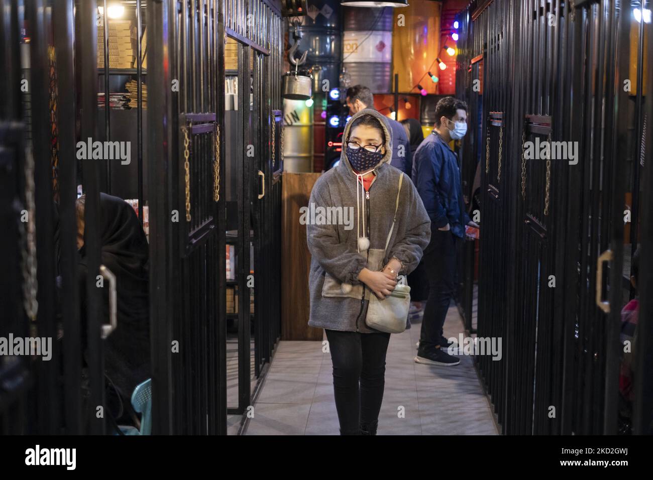 An Iranian woman looks at the cells while visiting the CELL-16 fast ...
