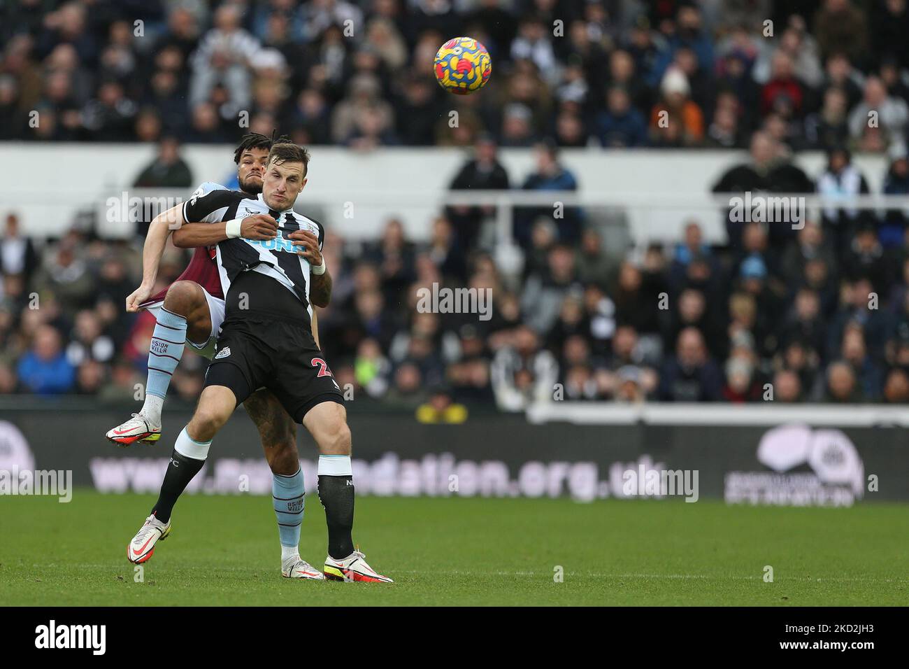 Aston Villa's Tyrone Mings battles with Newcastle United's Chris Wood ...