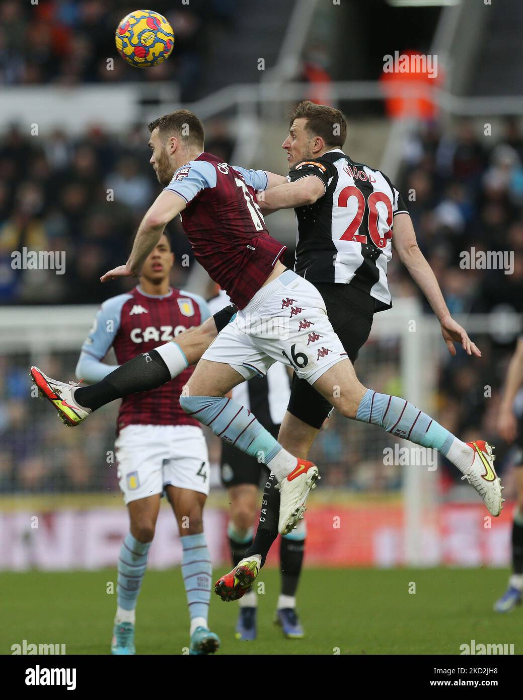Chris Wood of Newcastle United contests a header with Calum Chambers of ...