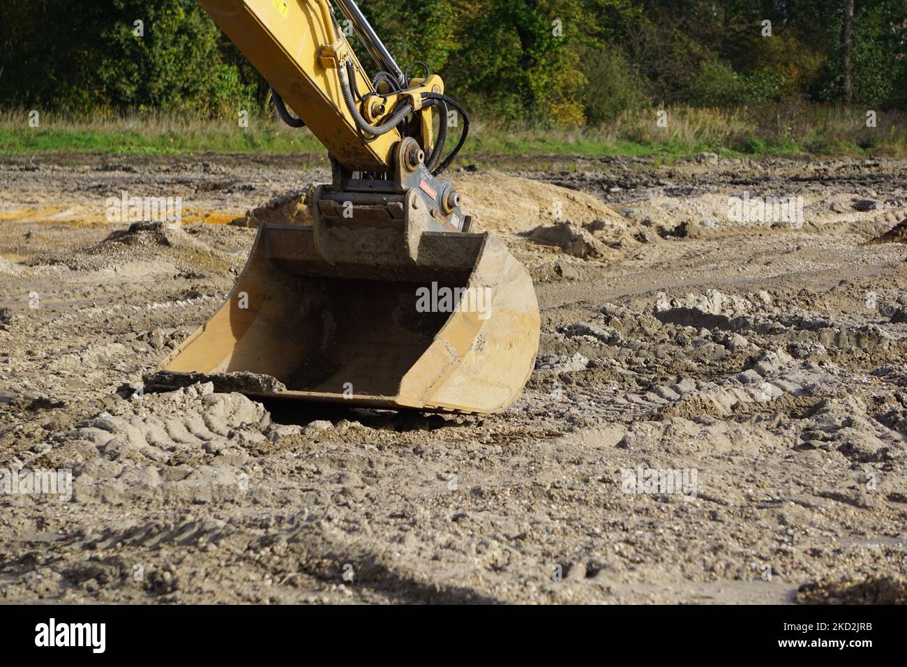 A close-up shot of a shovel machine bucket on a muddy ground Stock ...