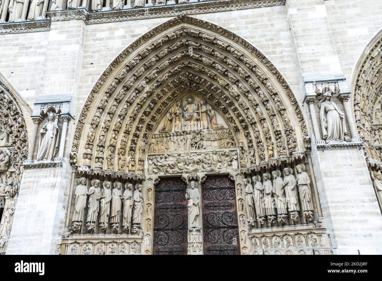 The main entrance door of Notre-Dame Cathedral with carved arch and ...