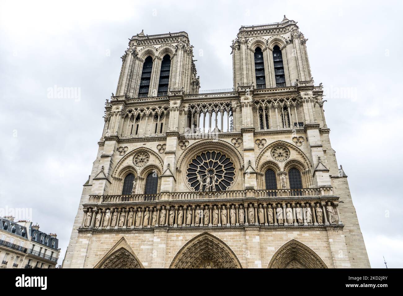 A facade shot of the famous Notre Dame Cathedral Bell Towers in Paris ...