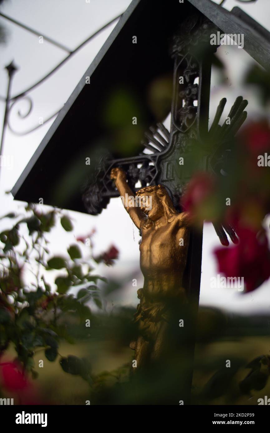 A vertical closeup shot of a sculpture of Jesus on the cross Stock ...