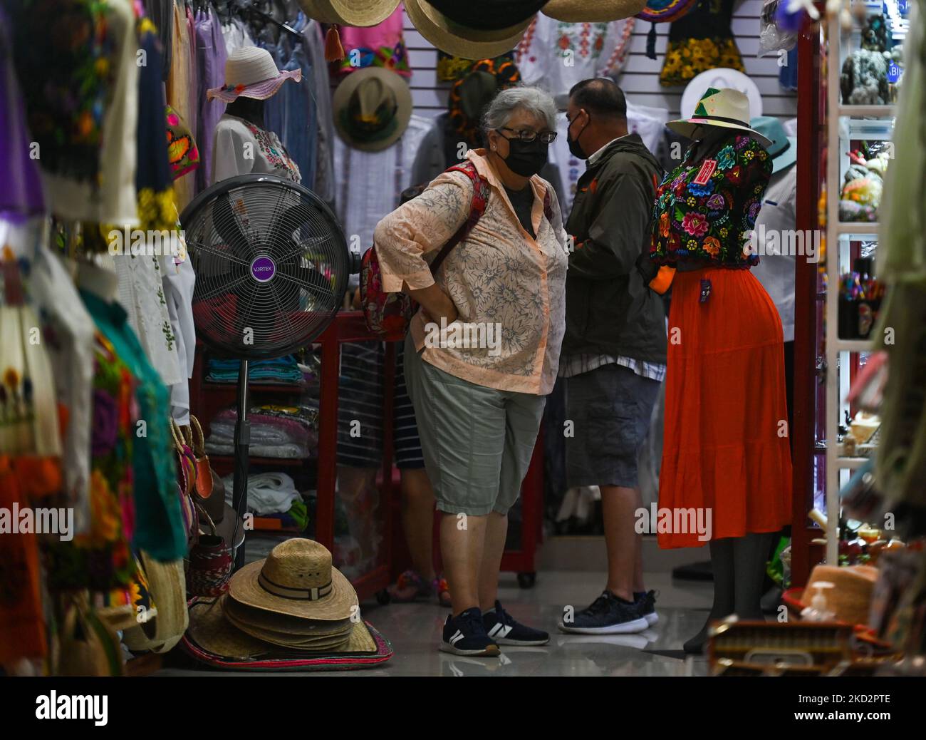 Visitors seen inside a shop with souvenirs, in Merida historical center ...