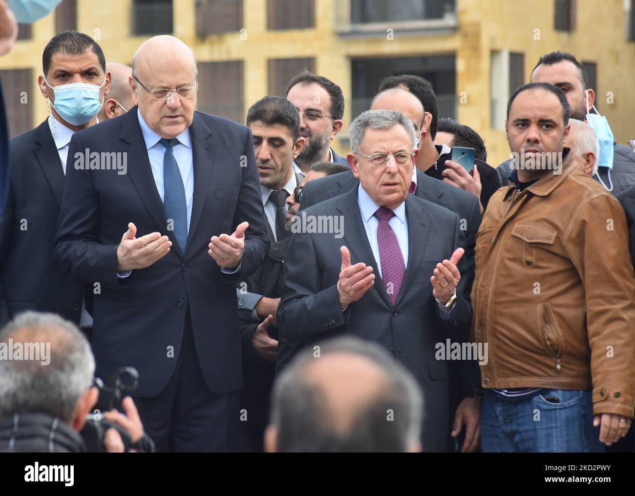 Lebanon's Prime Minister Najib Miqati (L) alongside former premier ...