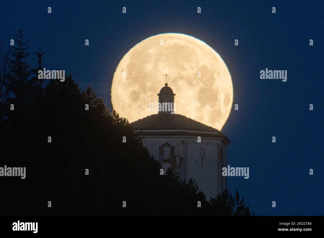 Full moon also known as "Snow Moon" sets behind Santa Maria della Pietà ...