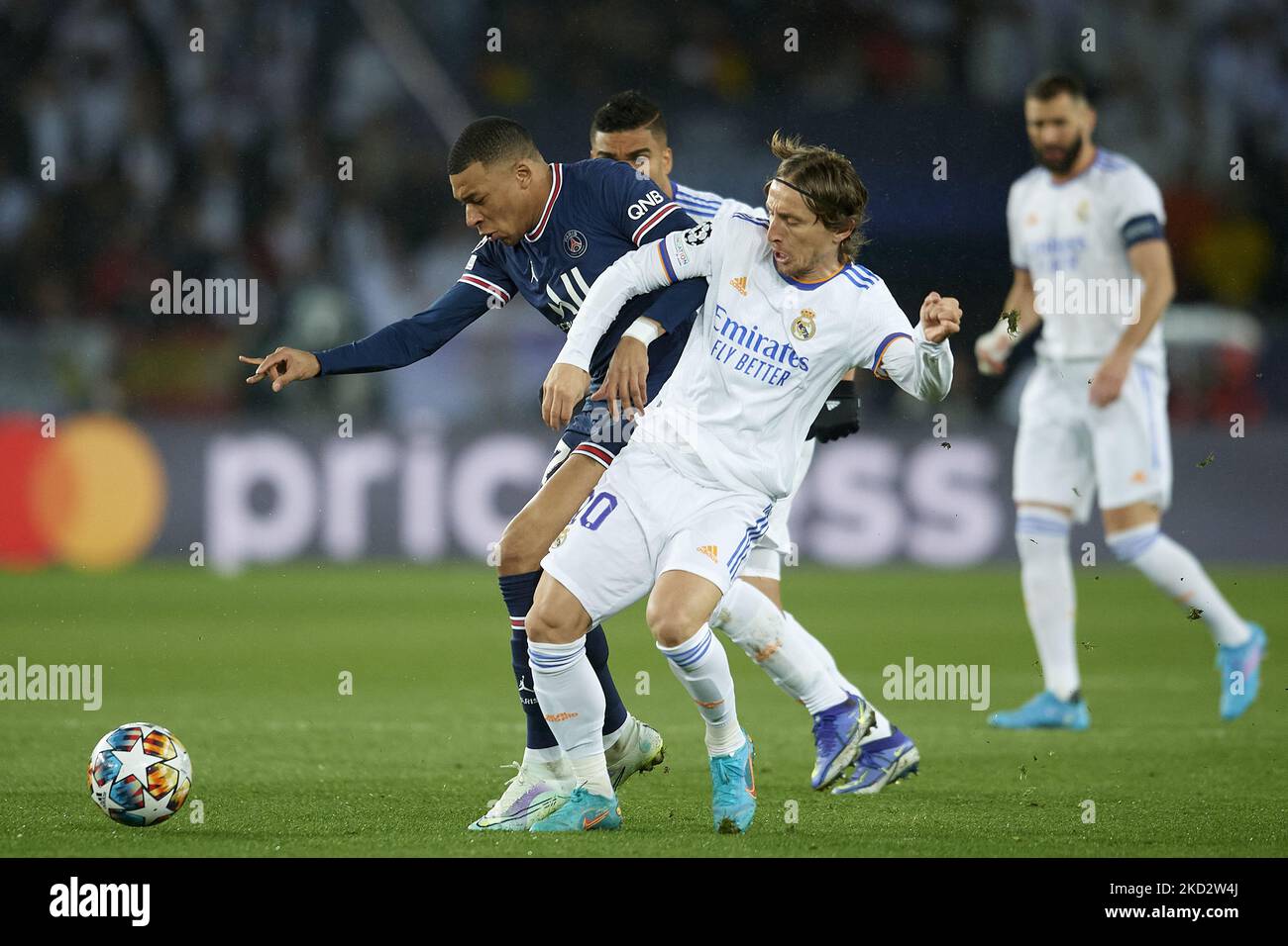 Kylian Mbappe of PSG and Luka Modric of Real Madrid compete for the ...