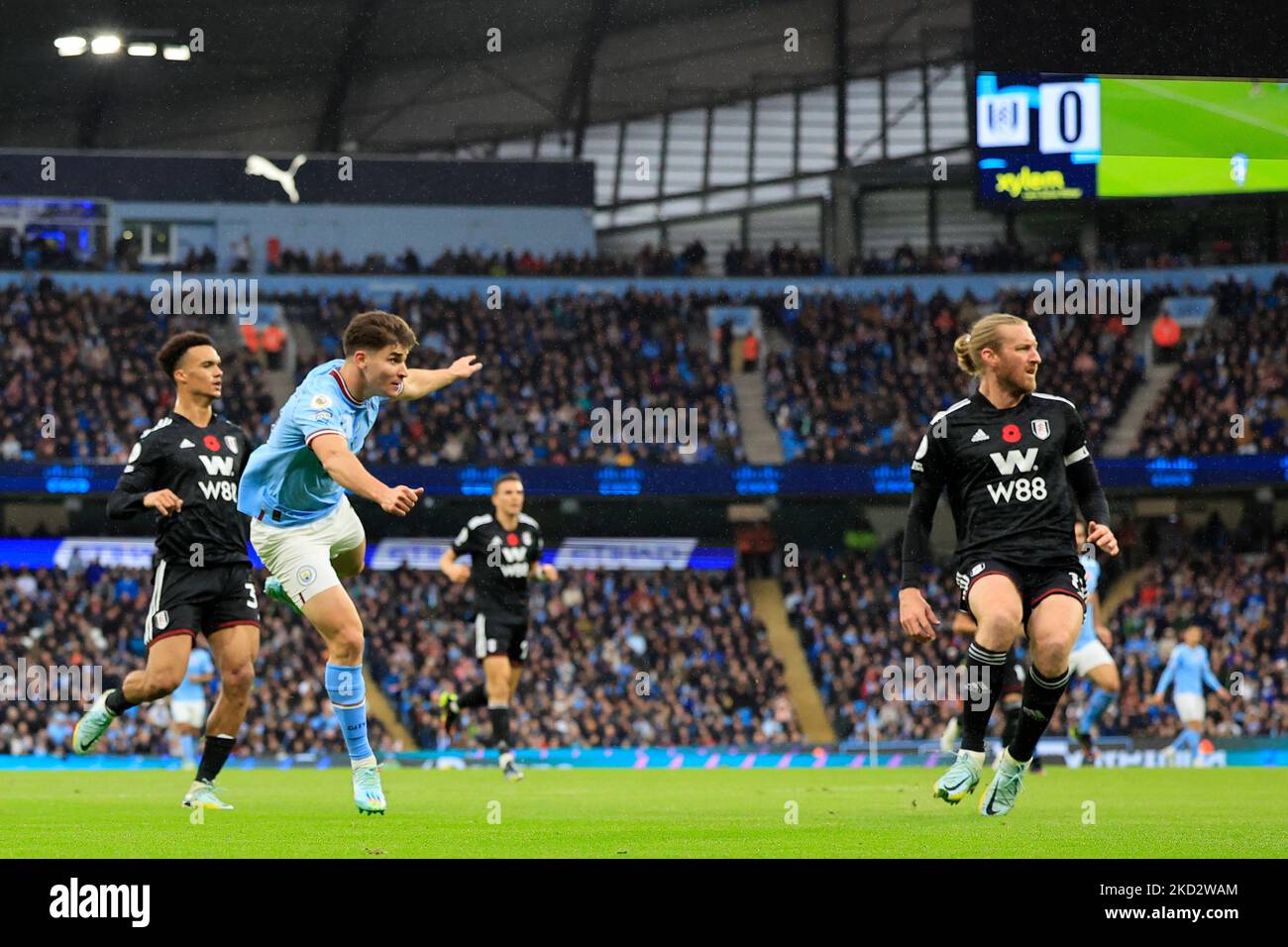 Julian Alvarez #19 of Manchester City scores to make it 1-0 during the Premier League match ...