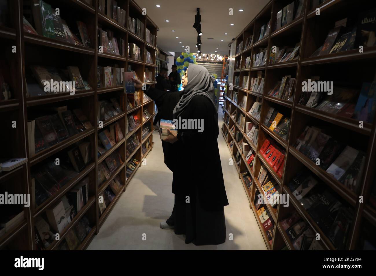 A Palestinian attends the reopening of the new Samir Mansour bookshop ...