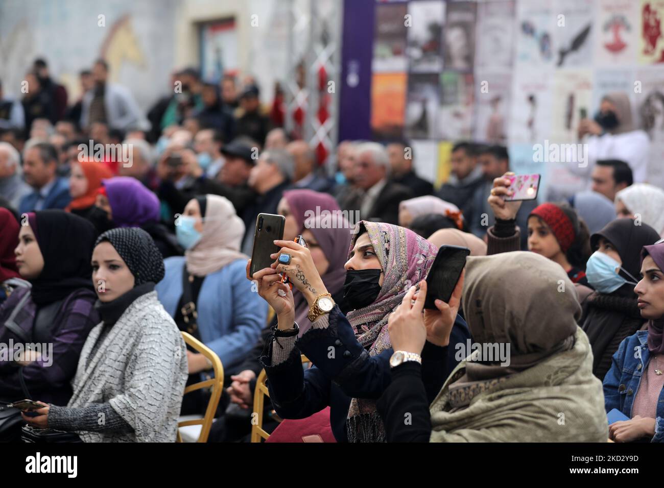 Palestinians attend the reopening of the new Samir Mansour bookshop ...
