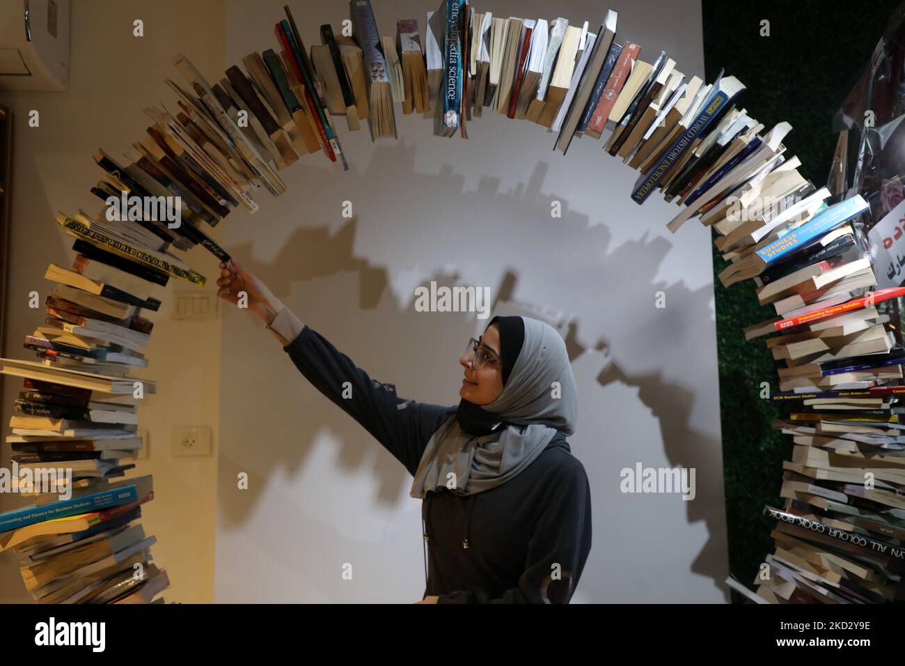 A Palestinian attends the reopening of the new Samir Mansour bookshop ...
