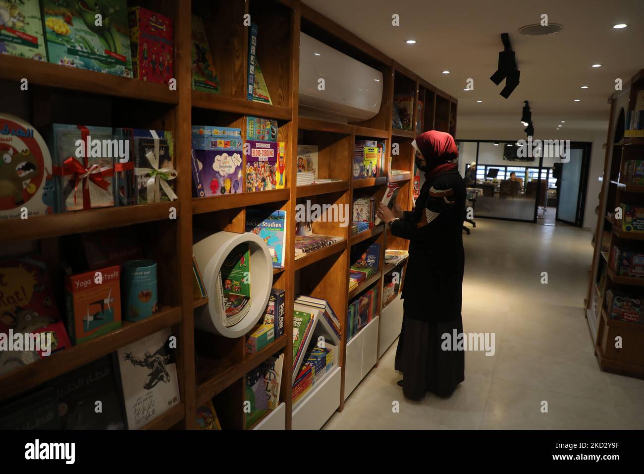 A Palestinian attends the reopening of the new Samir Mansour bookshop ...