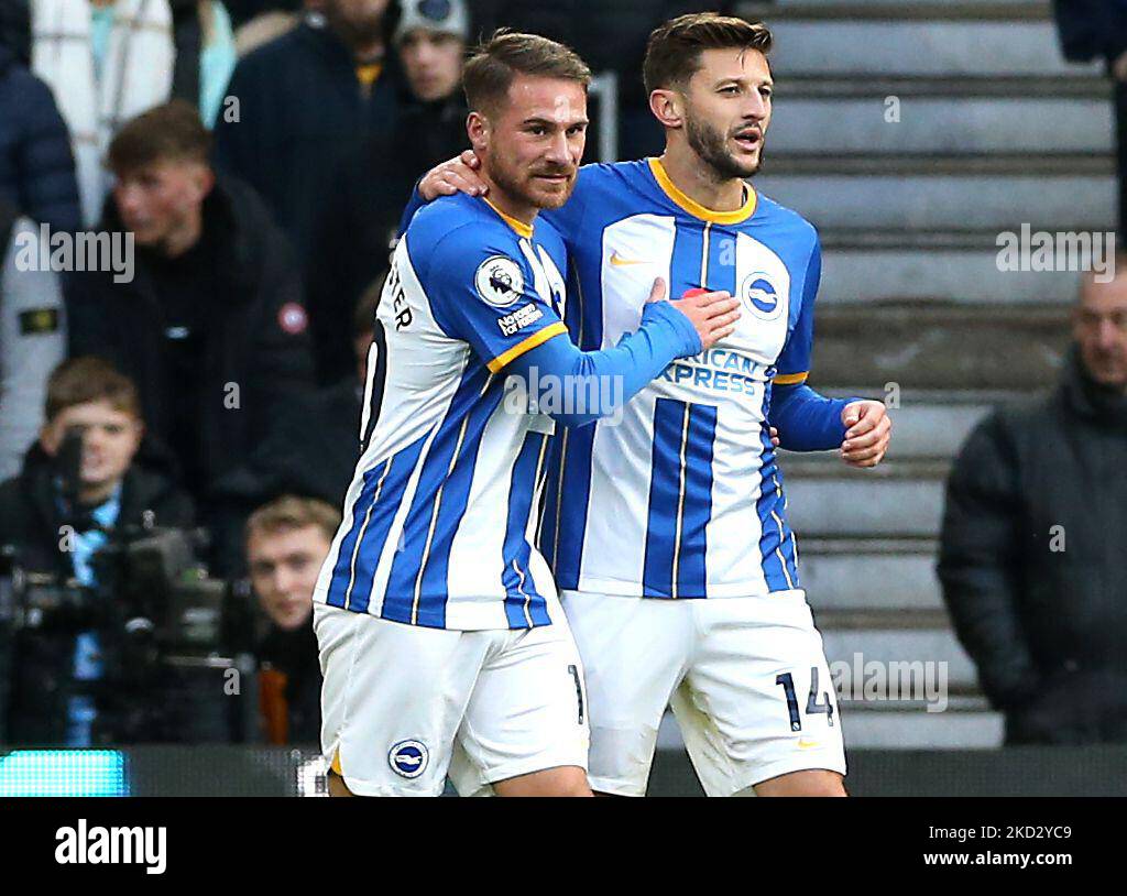 Brighton and Hove Albion's Adam Lallana (right) celebrates scoring ...