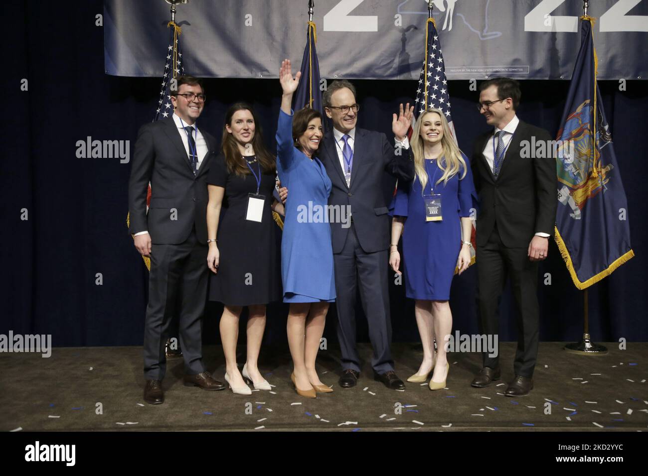 New York Gov. Kathy Hochul stands on stage withher family during the ...