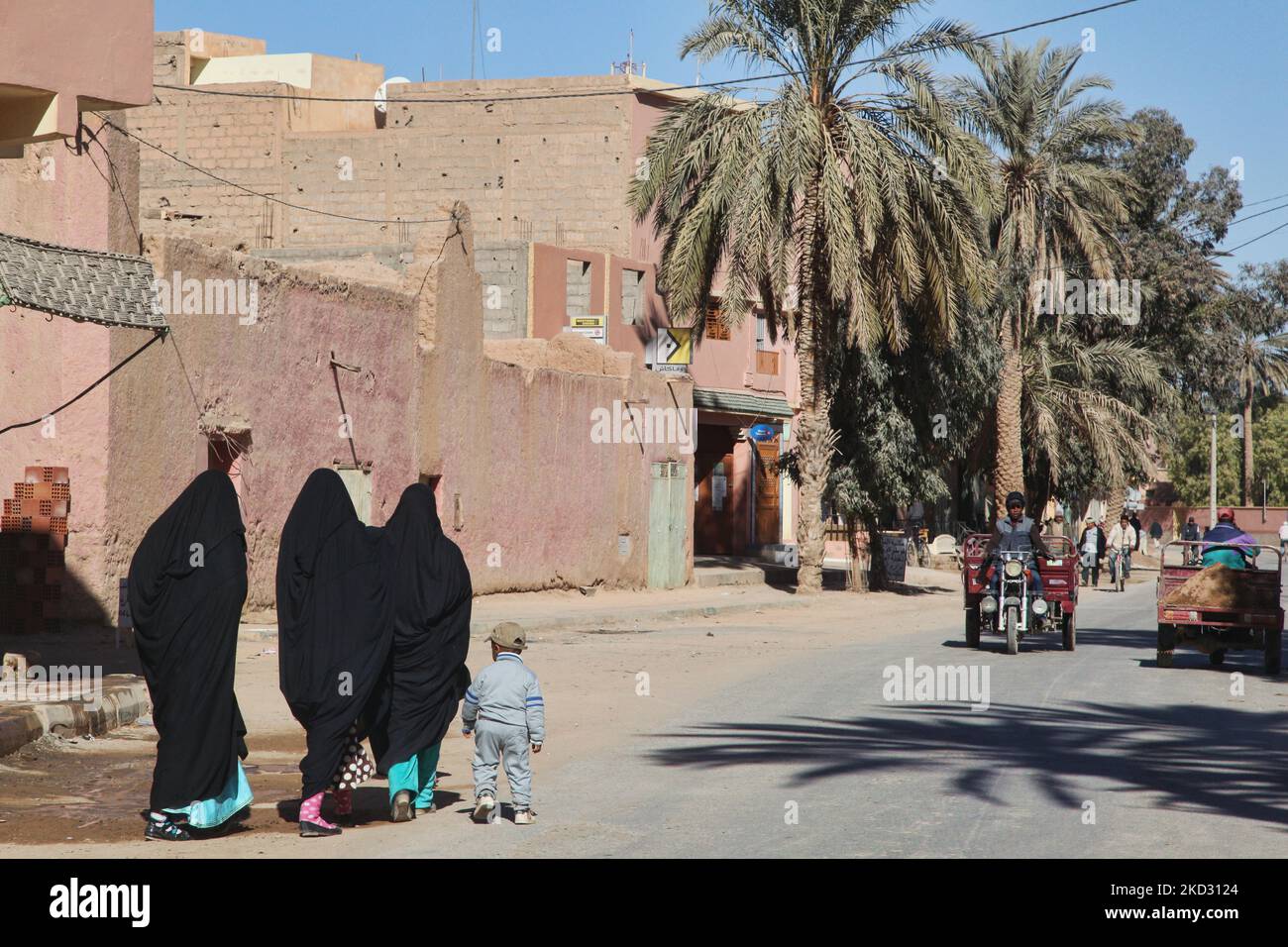 Women (who are wearing traditional black 'haik' body cloaks) in a ...