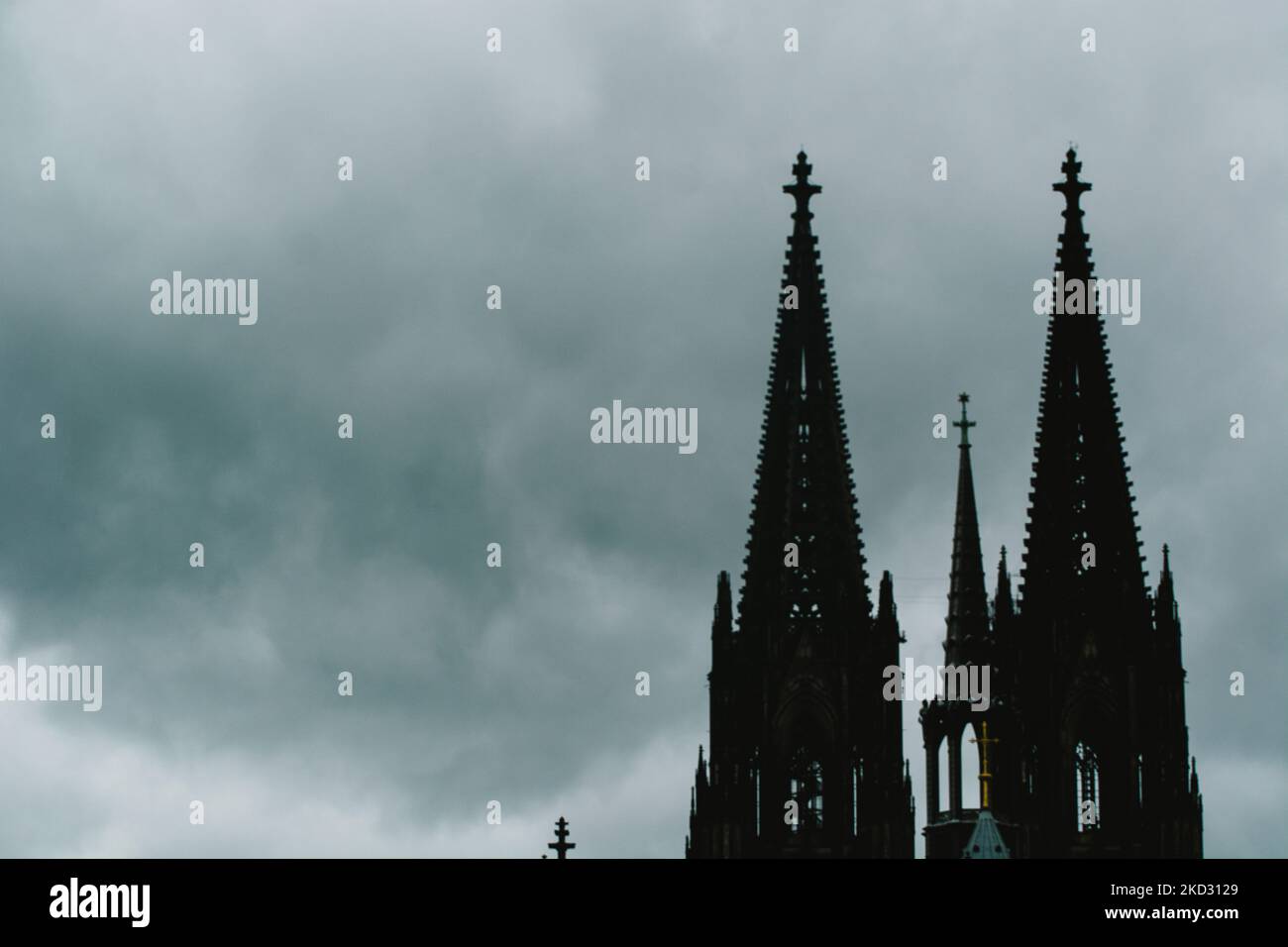 the dark looming cloud is seen covering the Dom Cathedral in Cologne ...