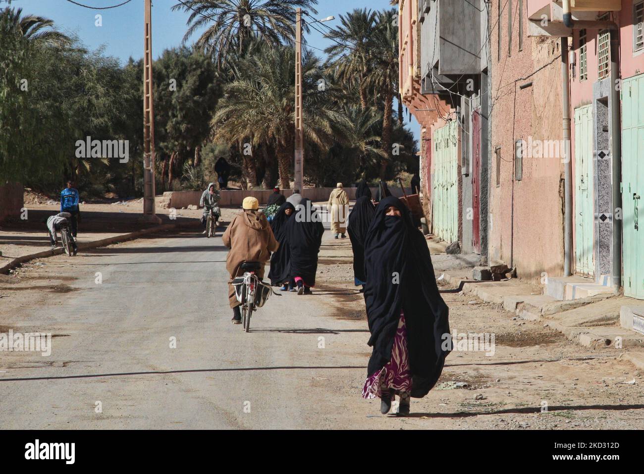 Women (who are wearing traditional black 'haik' body cloaks) in a ...
