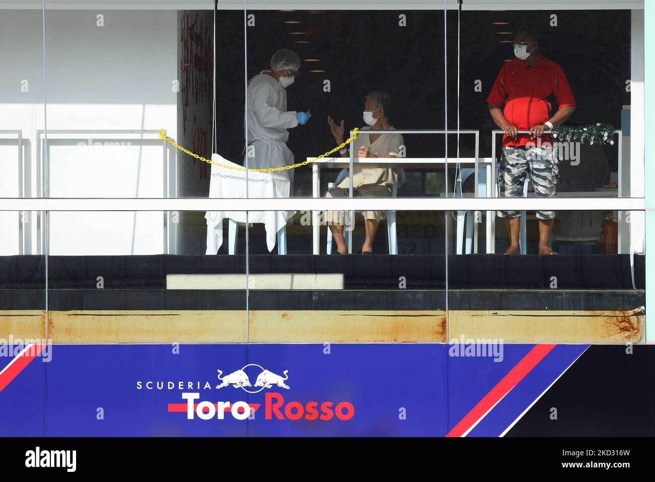 A healthcare worker dressed in personal protective equipment (PPE ...