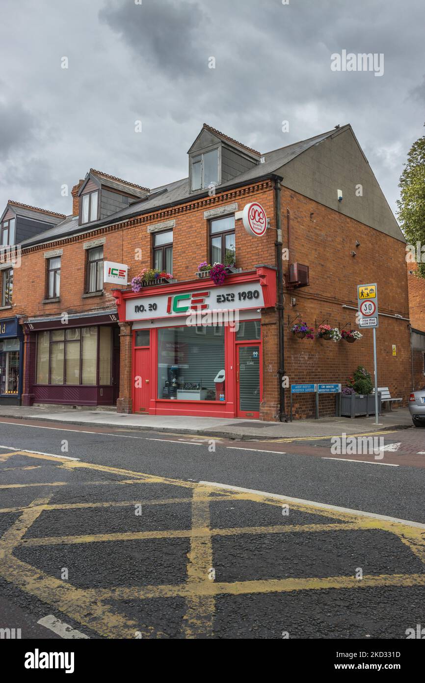 The vertical view of Dublin city buildings with closed shops under the ...