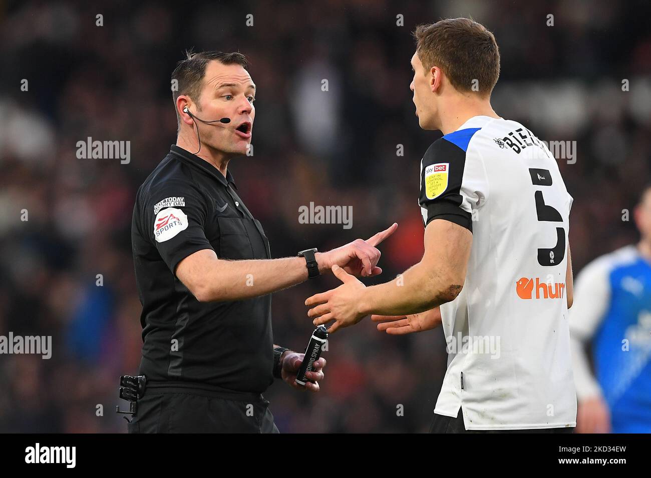 Referee, James Linington instructs Krystian Bielik of Derby County to ...