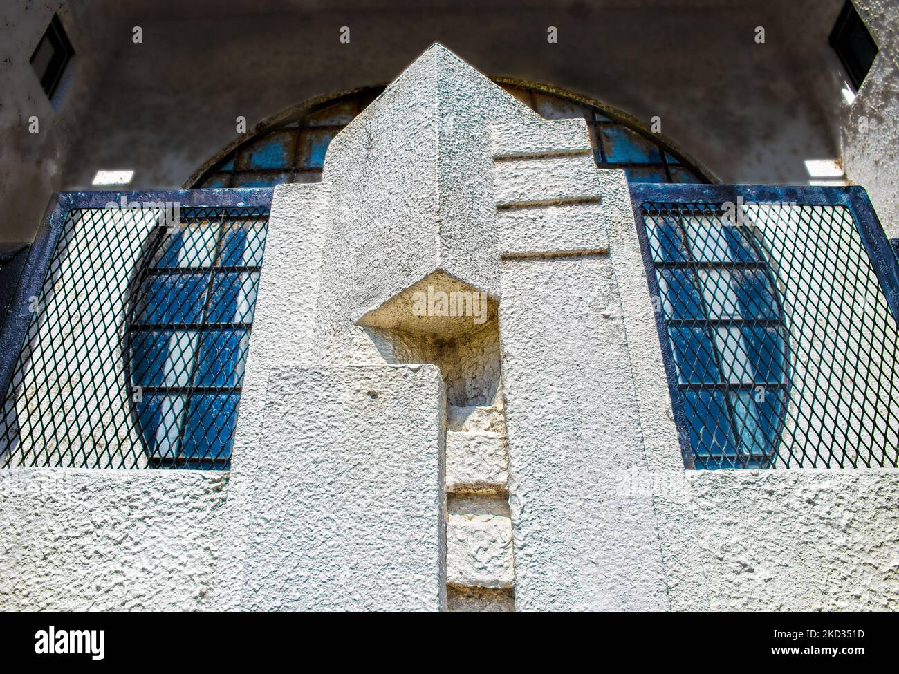 Close-up of detail of old grungy art deco building with round window ...