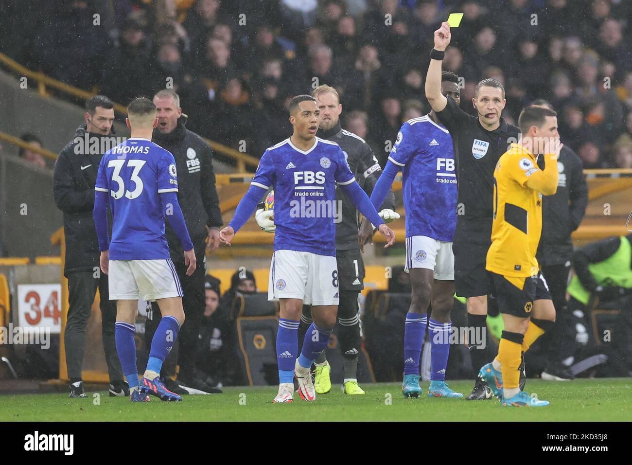 Match referee, Craig Pawson shows Daniel Podence of Wolves the yellow card during the Premier ...