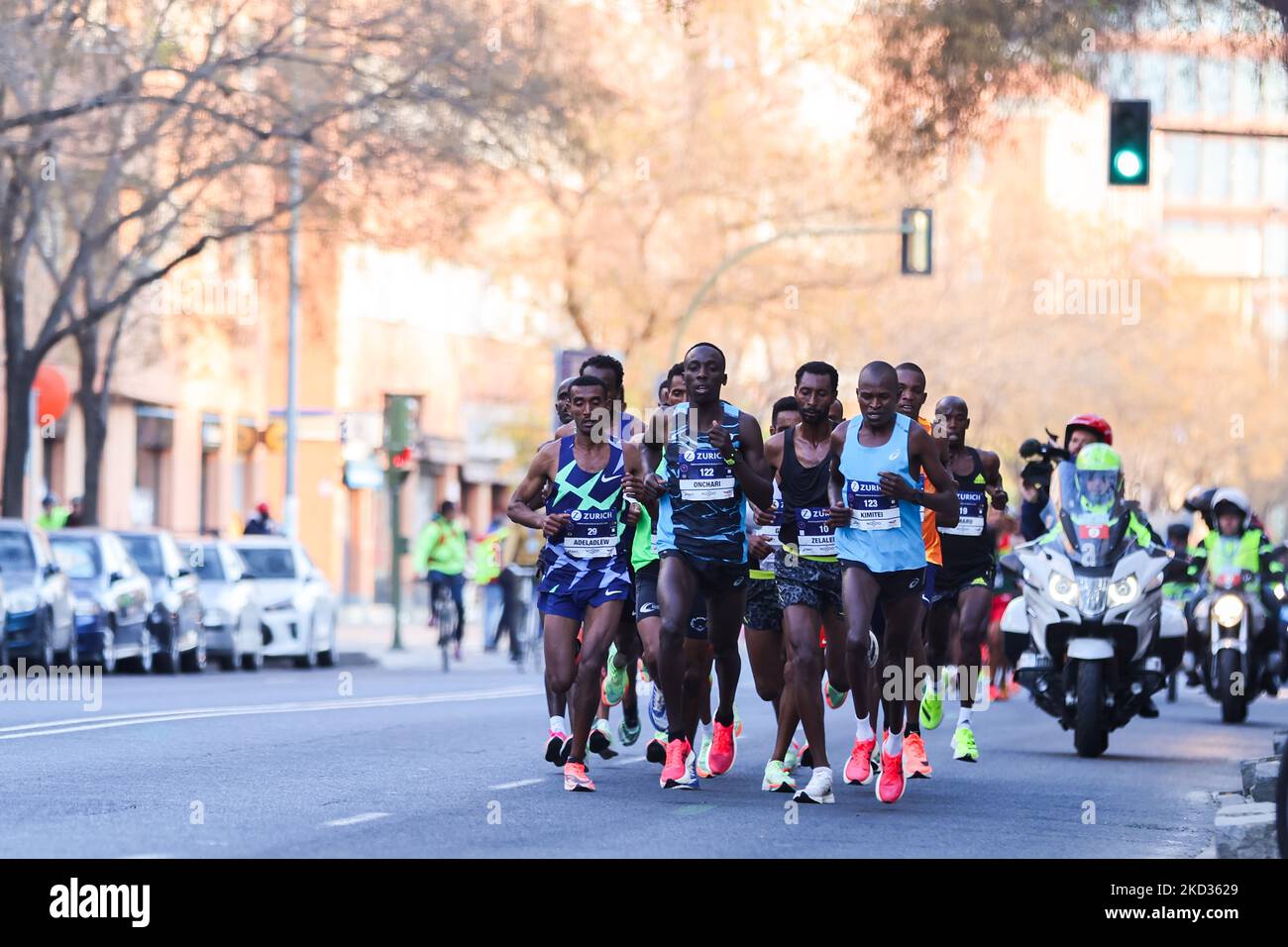 Participants run during the Zurich Seville Marathon in Seville, Spain ...