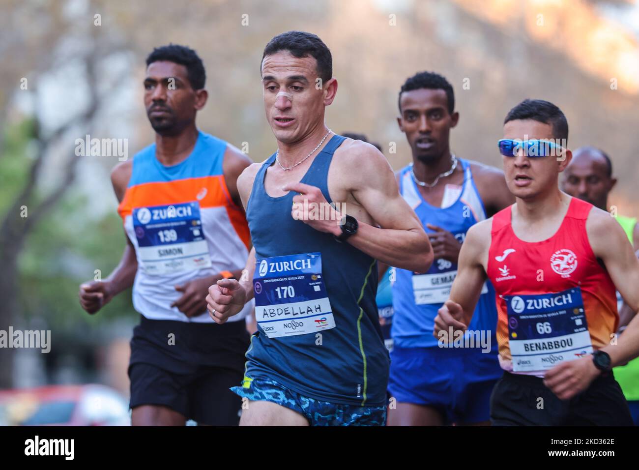 Participants run during the Zurich Seville Marathon in Seville, Spain ...