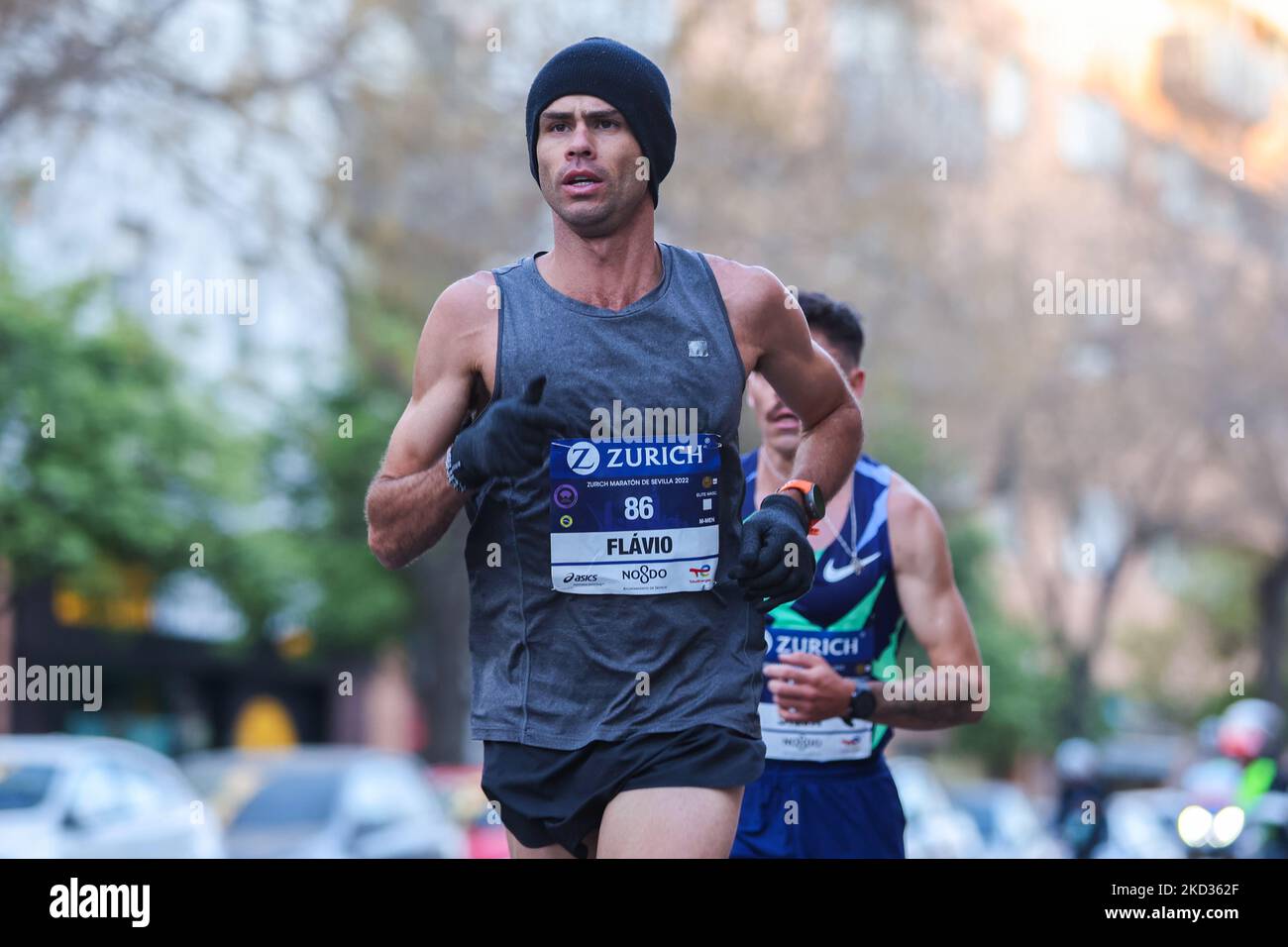 Participants run during the Zurich Seville Marathon in Seville, Spain ...