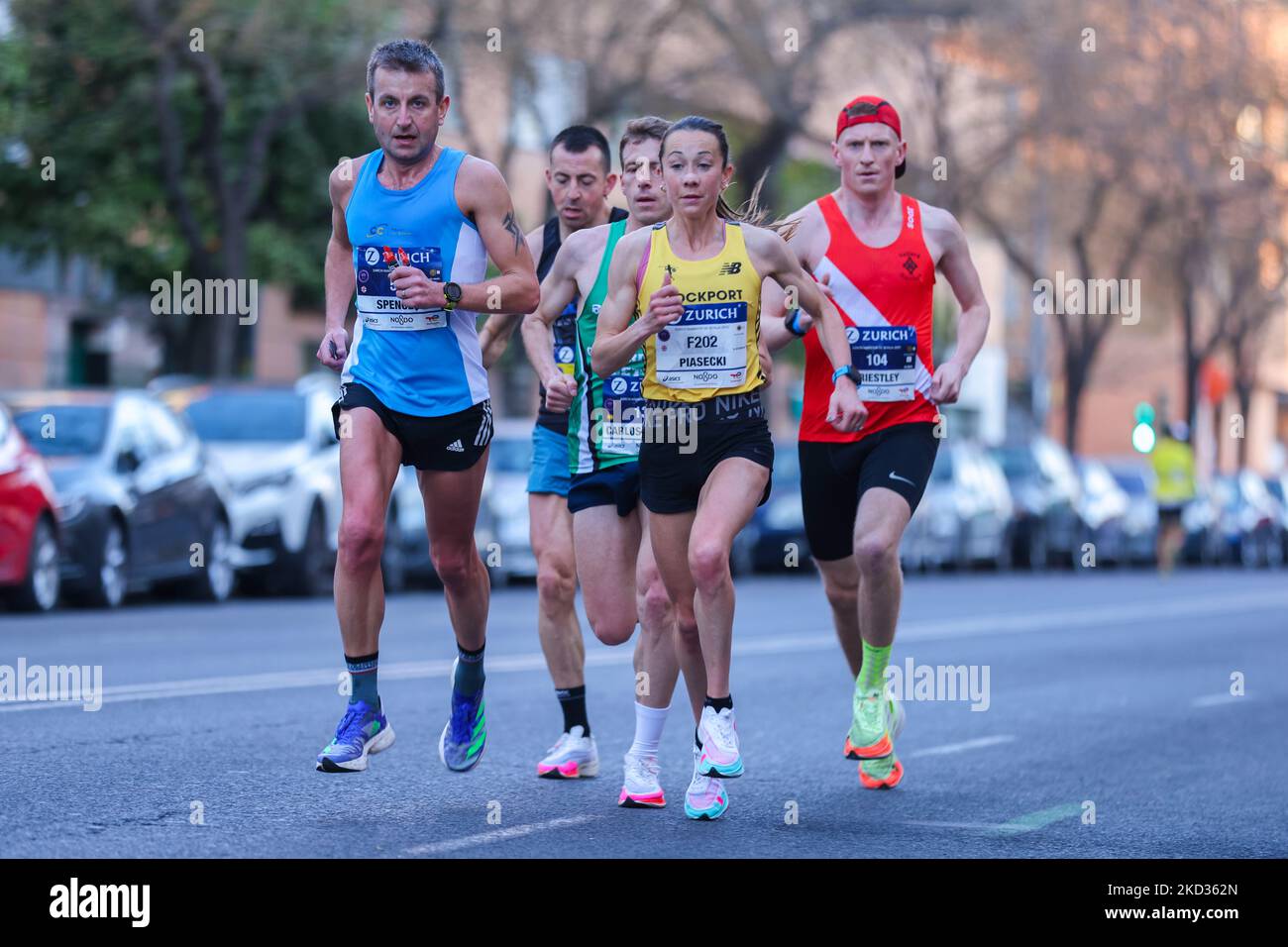 Participants run during the Zurich Seville Marathon in Seville, Spain ...