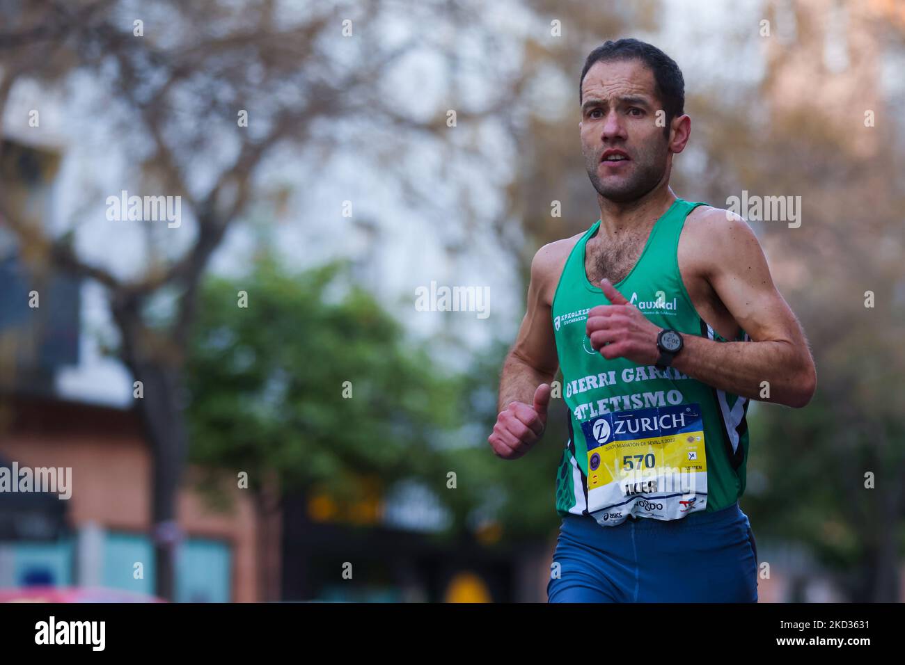 Participants run during the Zurich Seville Marathon in Seville, Spain ...