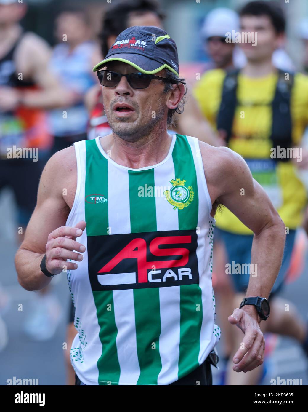 Participants run during the Zurich Seville Marathon in Seville, Spain ...