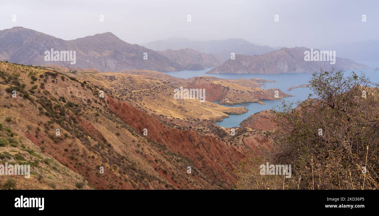 Panoramic landscape view of colorful Nurek or Norak dam lake and valley ...