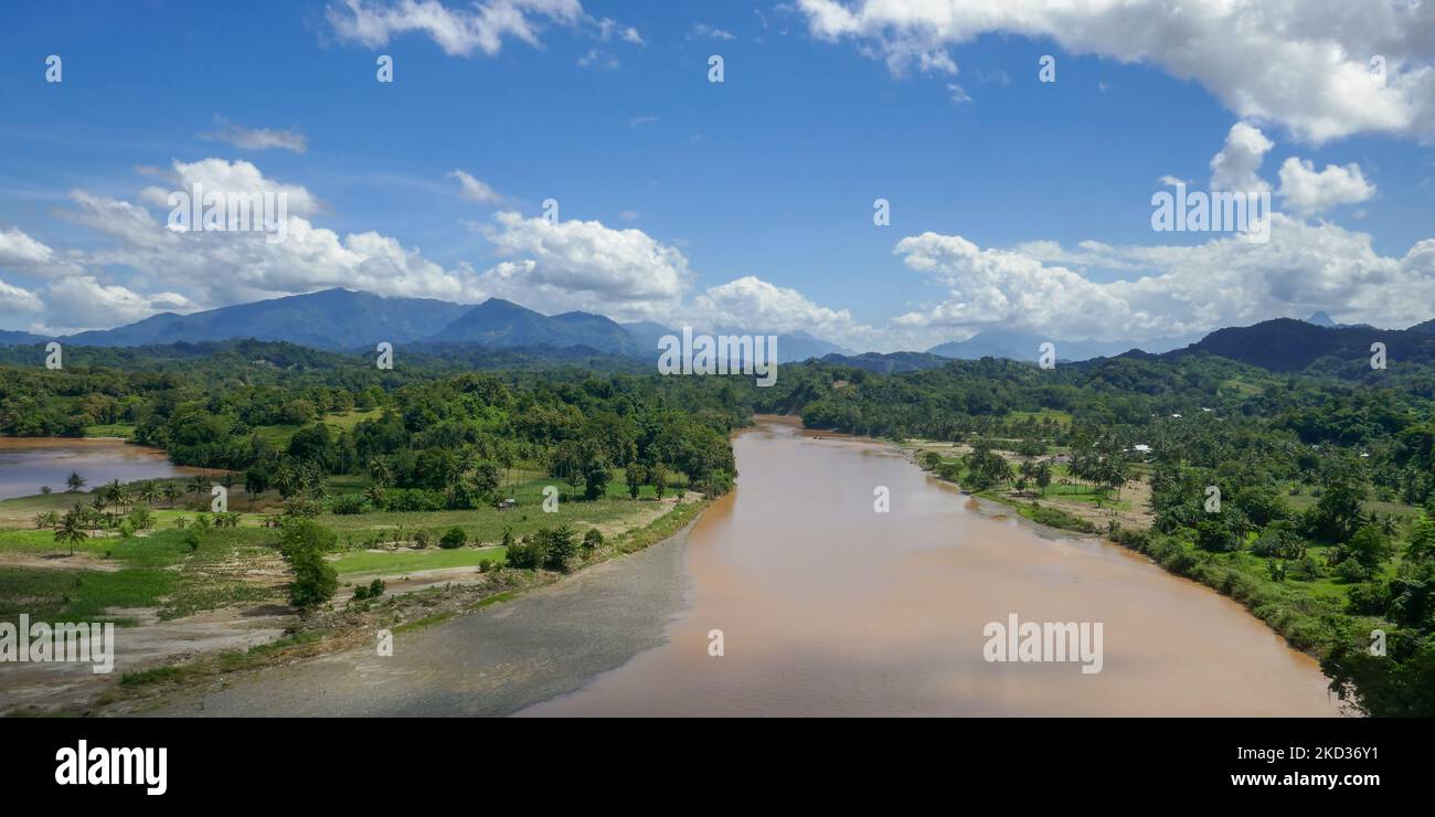 Scenic tropical rural landscape with Sadang river, forest and mountain ...